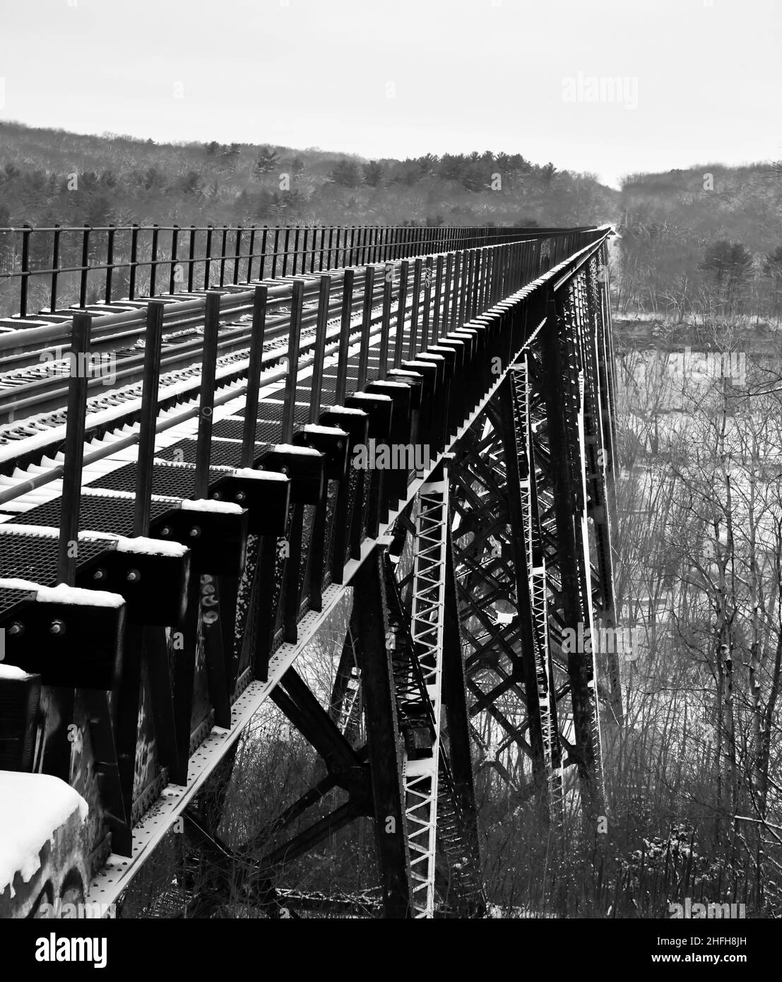 Empty snow covered railroad bridge in winter Stock Photo - Alamy