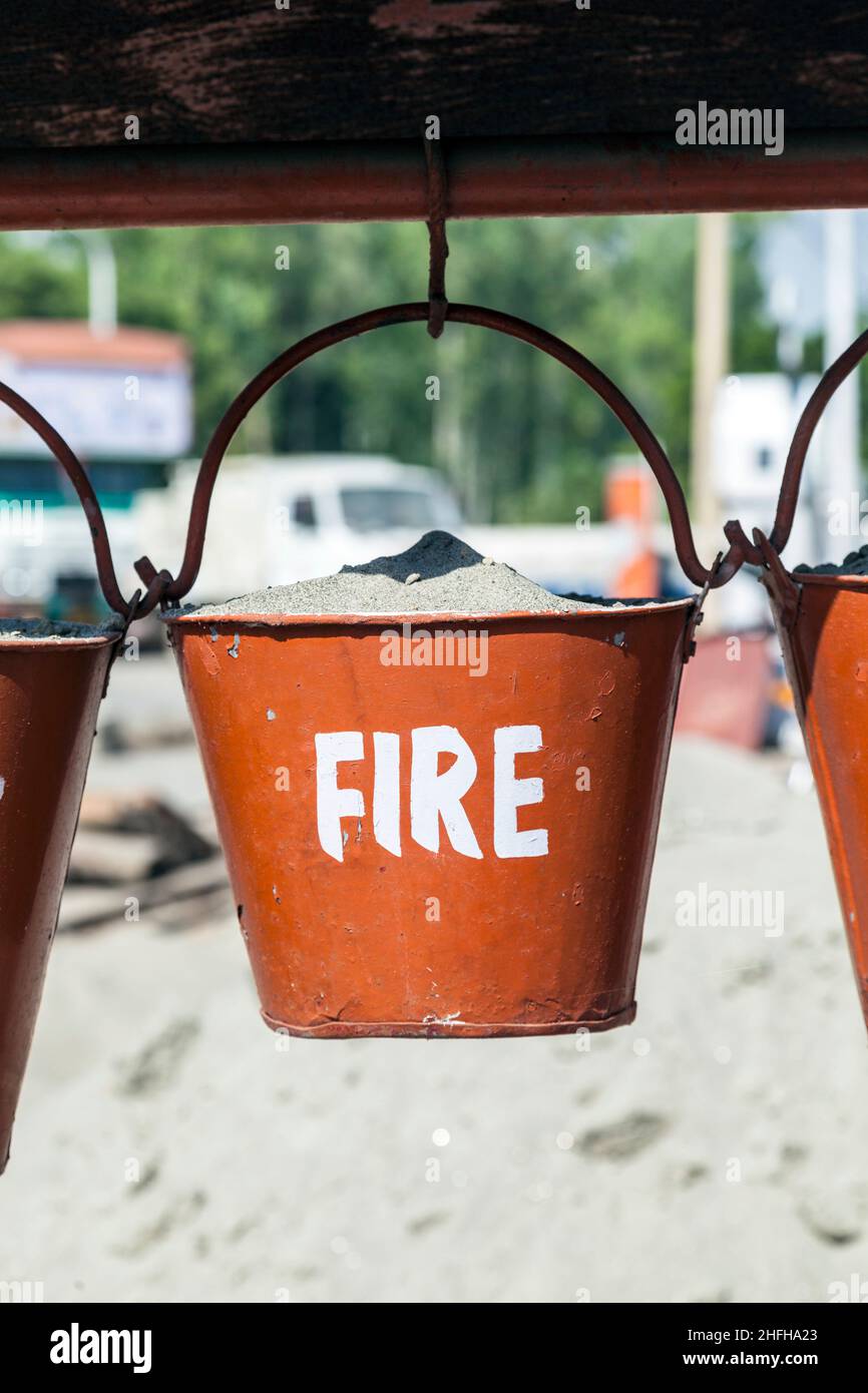 bucket with sand in a petrol station for fire fighting Stock Photo - Alamy