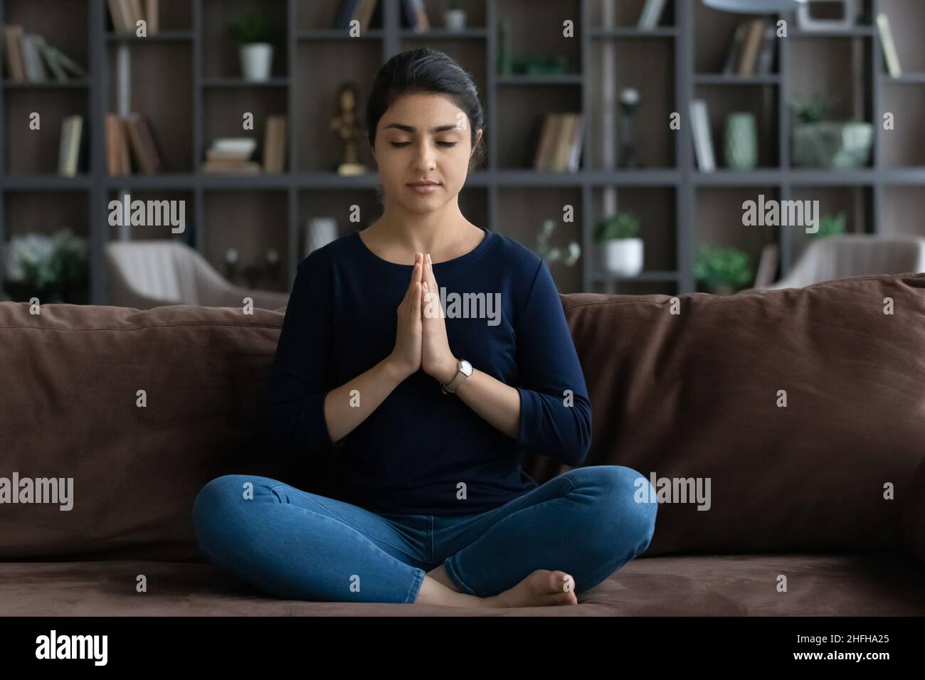 Happy peaceful young Indian woman praying God Stock Photo - Alamy