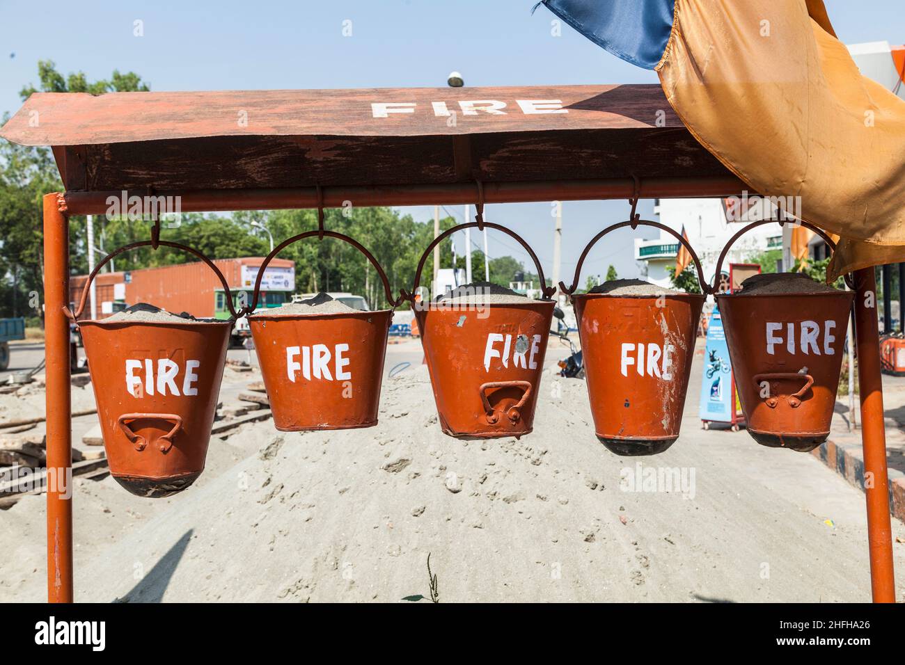 bucket with sand in a petrol station for fire fighting Stock Photo - Alamy