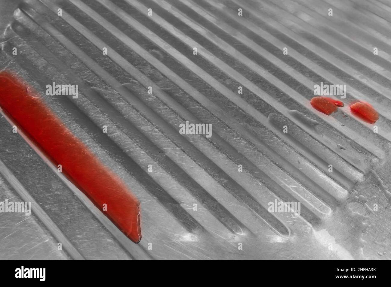 Traces of blood on a steel medical tray after surgery. Surgical ...