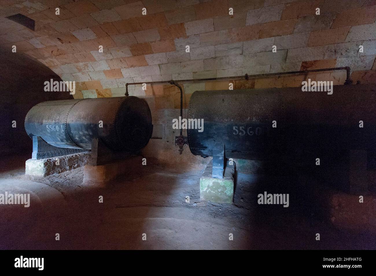 Old fuel tanks from a military complex Stock Photo - Alamy