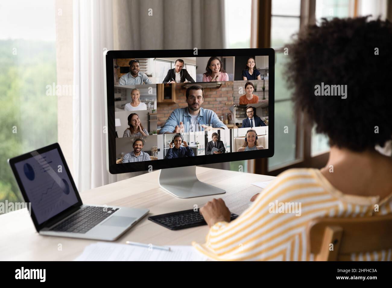 Focused young African American woman holding video conference call ...