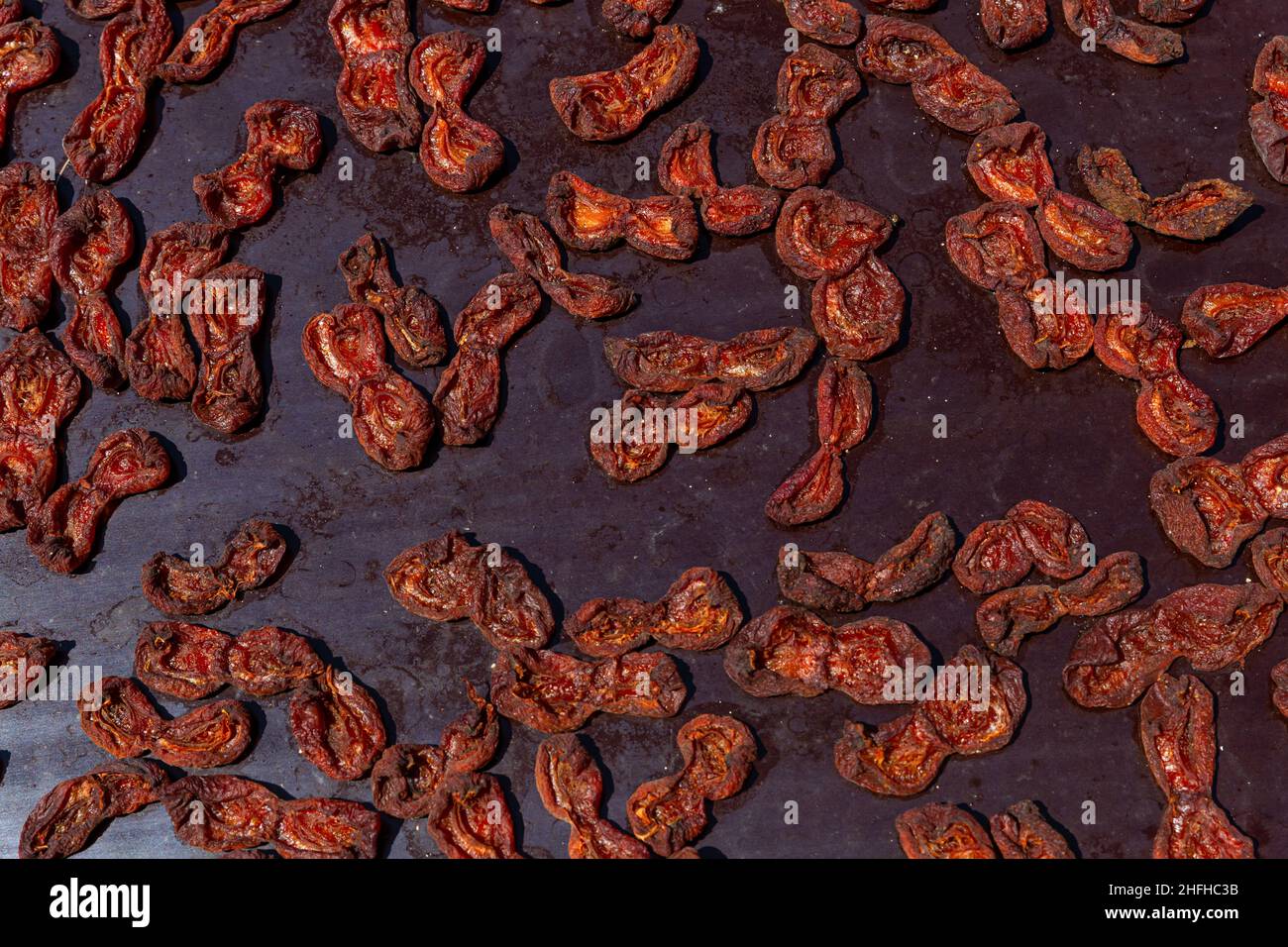 Dried pitted apricots on brown background top view. Harvesting and ...