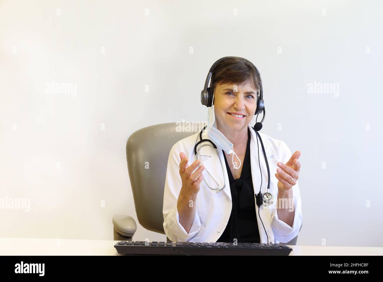 kind doctor explaining during telemedicine online session Stock Photo ...
