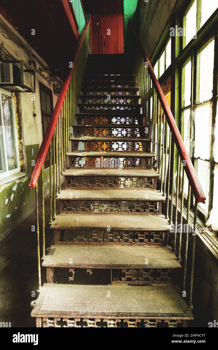 An old metal staircase leading up in a poor quarter of the city Stock ...