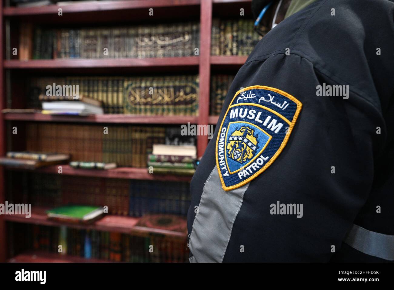 An NYPD Muslim Community Patrol Officer attends the mass funeral for ...