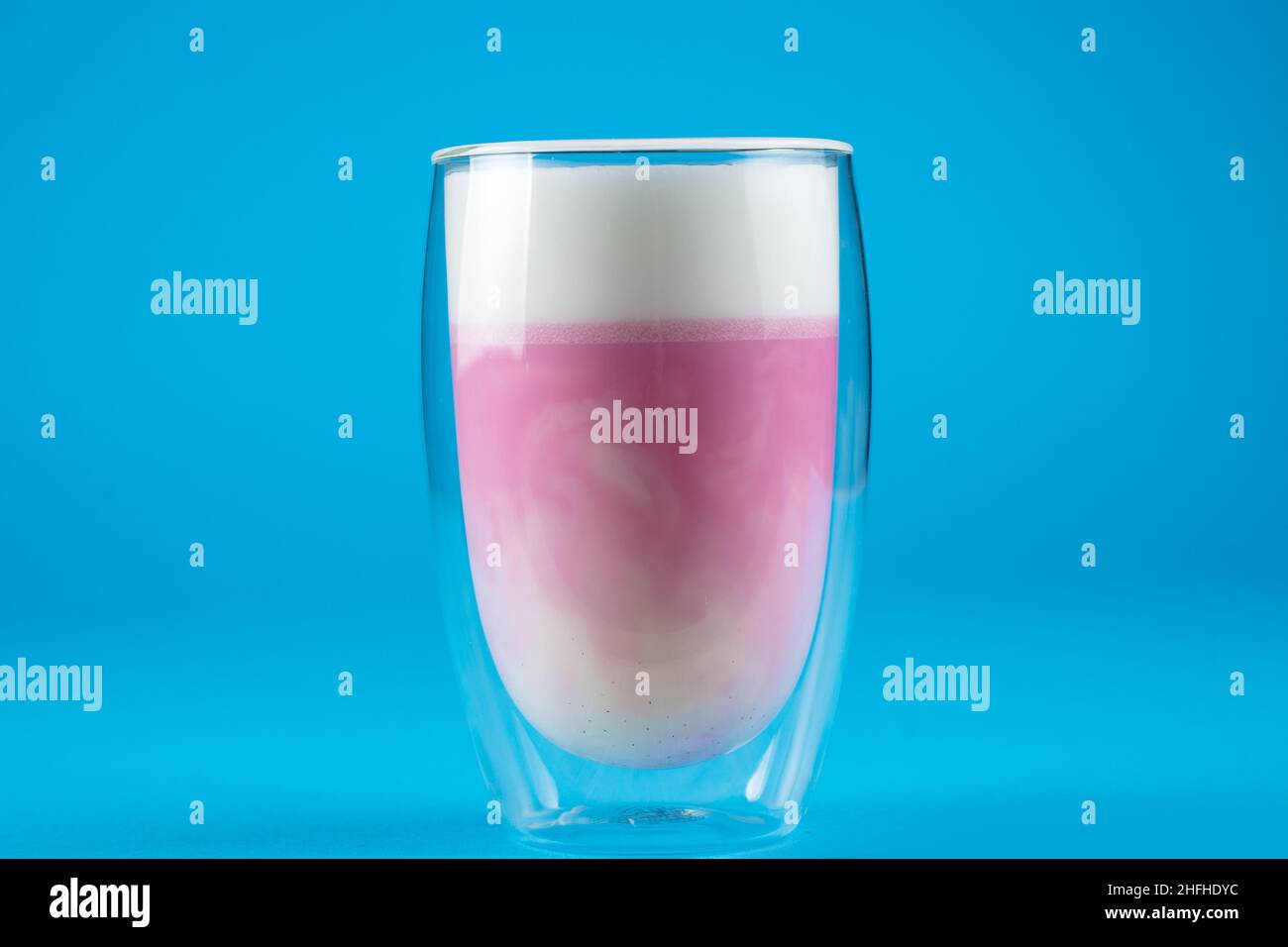 Pitahaya pink matcha on blue background. Matcha from dragon fruit ...