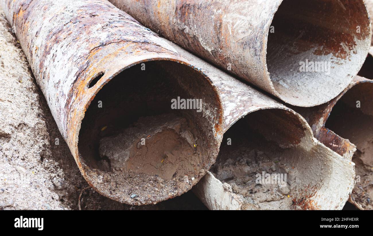 Fragments of old large water pipes. After many years of operation ...