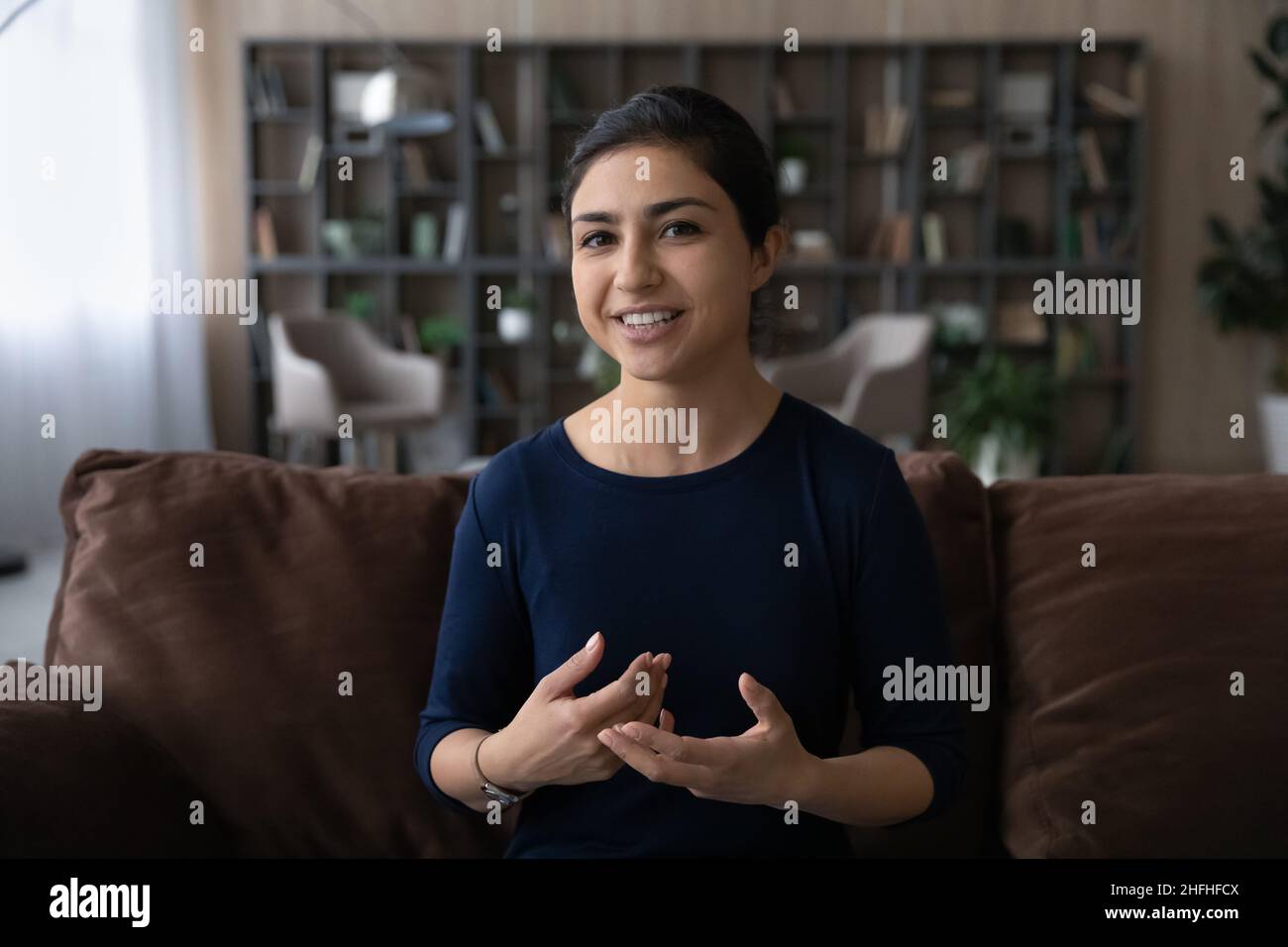 Happy young woman talking web hi-res stock photography and images - Alamy