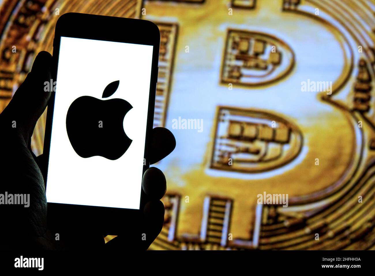In this photo illustration an Apple logo seen displayed on a smartphone ...