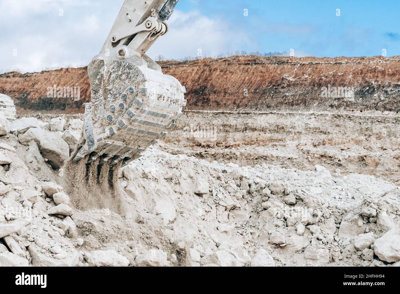 Close-up view of excavator large bucket on construction site or quarry ...