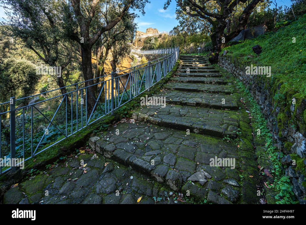 An ancient cobbled street in the Roman city of Cumae at Cumae ...