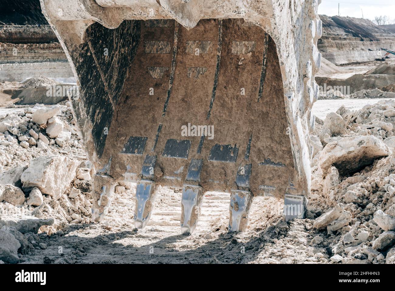 Close-up view of excavator large bucket on construction site or quarry ...