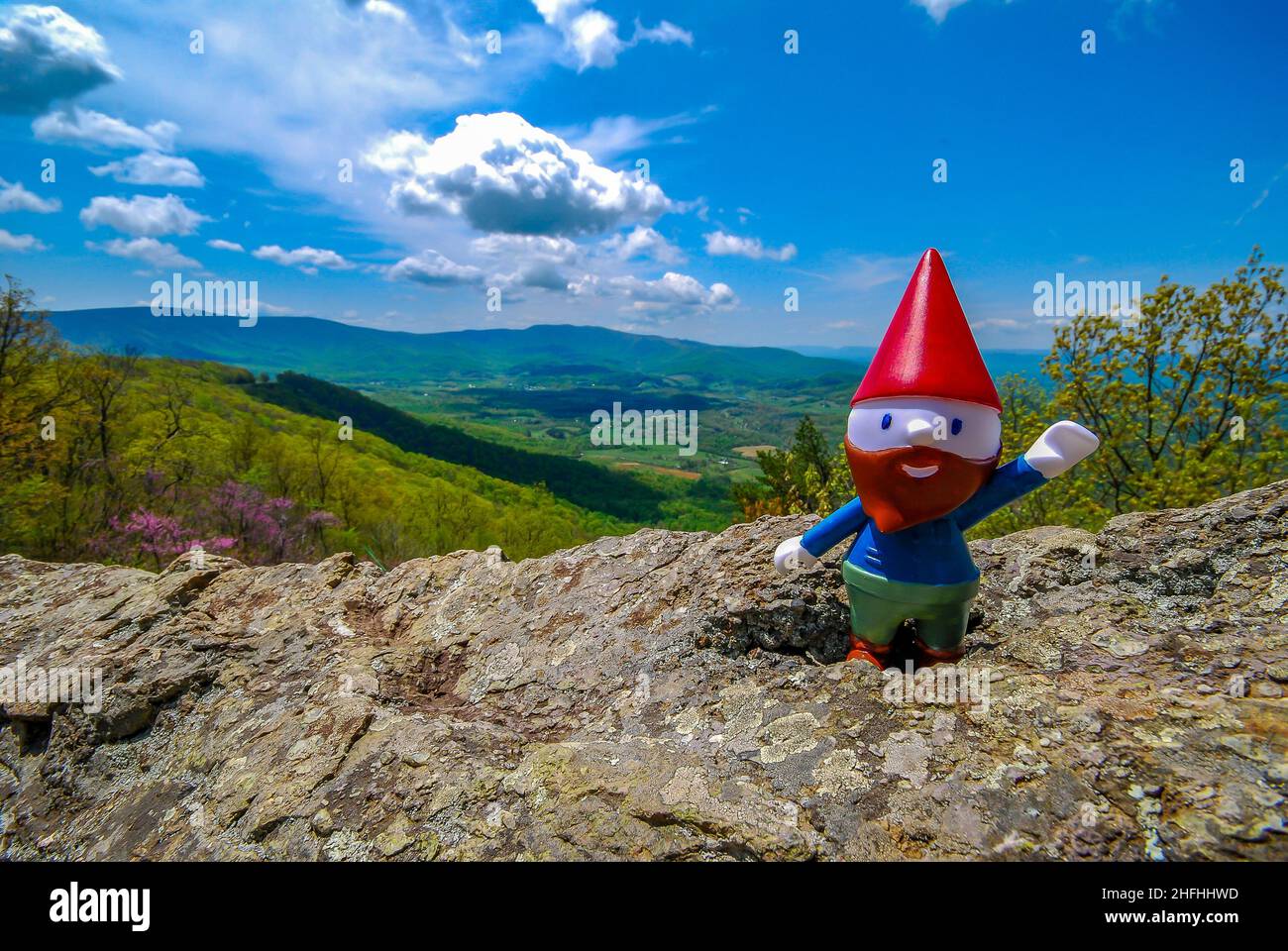 Gnome hiking in the mountains at an overlook Stock Photo - Alamy