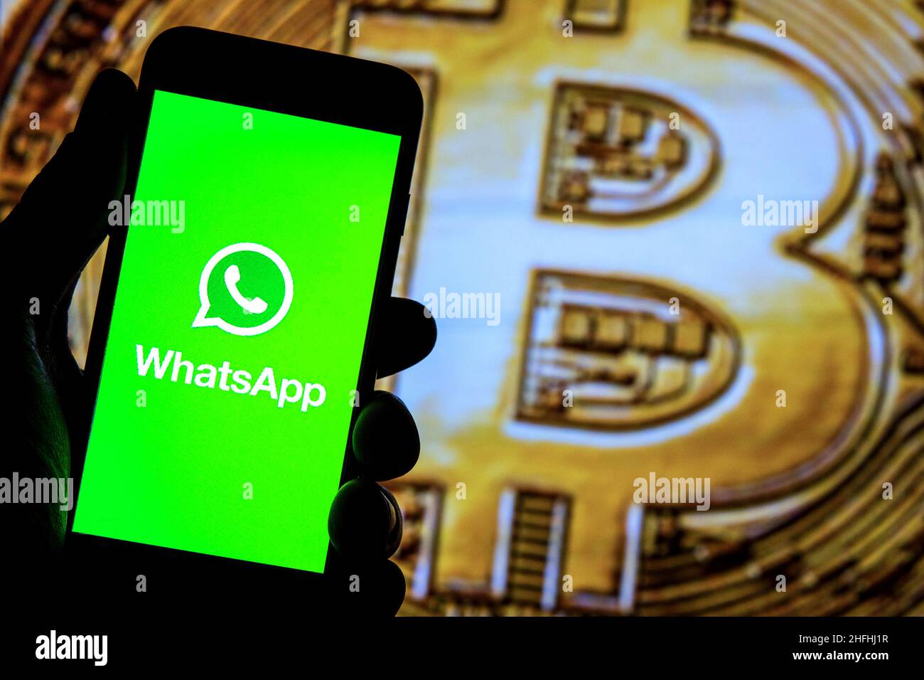 In this photo illustration a WhatsApp logo seen displayed on a ...