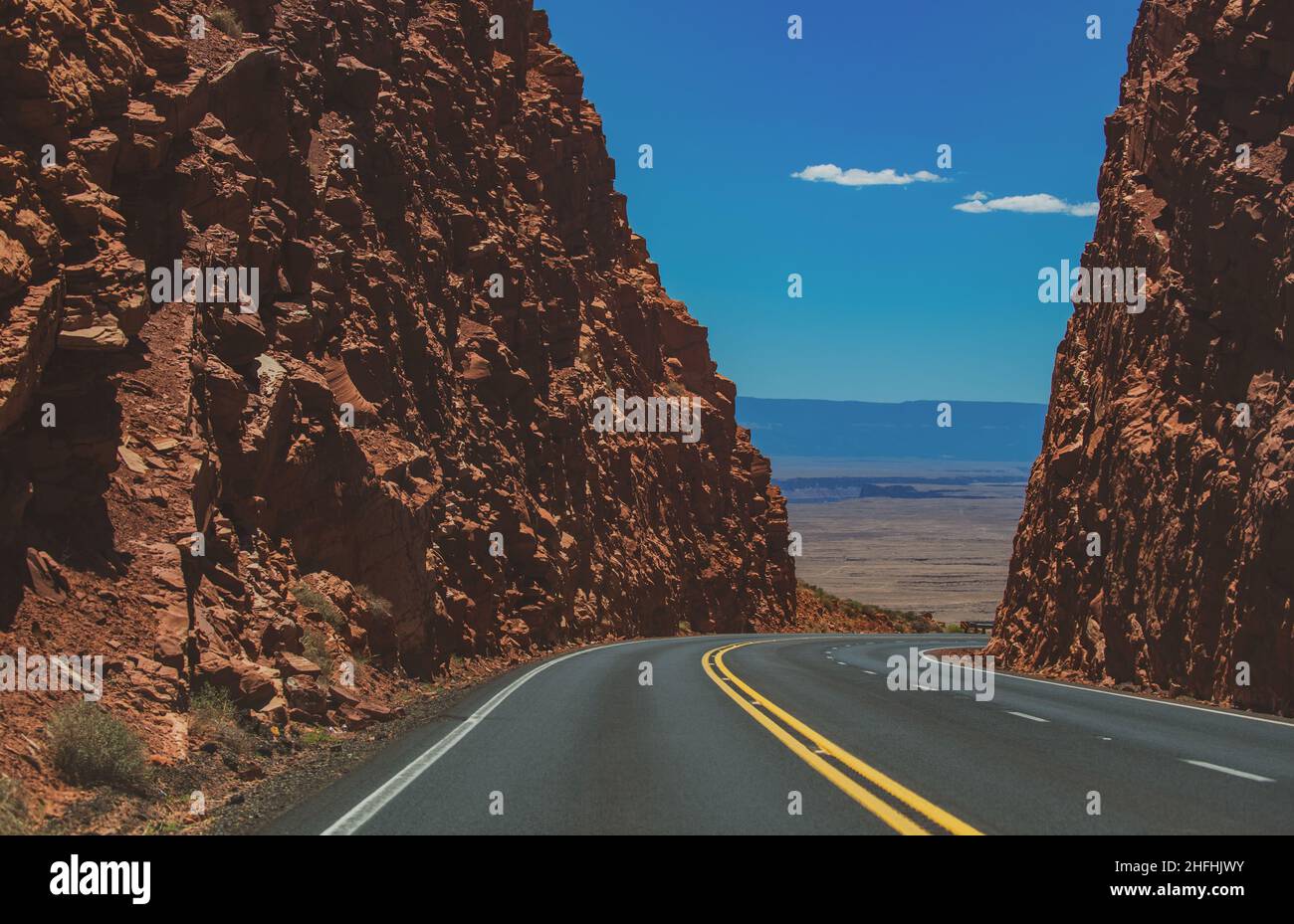 American road trip. Rural asphalt road among the rock mountain road ...