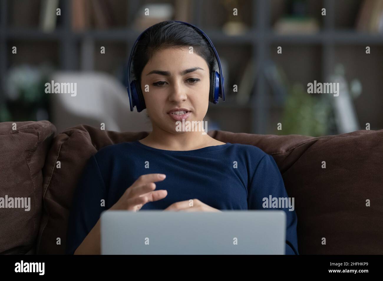 Concentrated millennial Indian woman holding video call meeting Stock ...