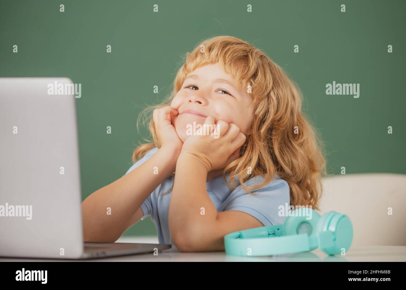 School boy dreaming on lesson in class at school. Education and ...