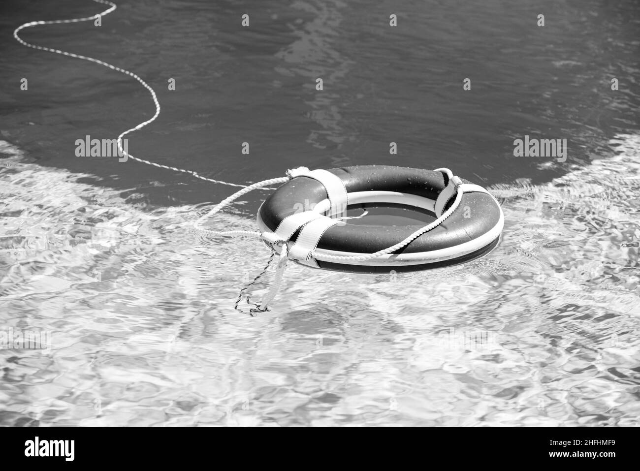 Lifebuoy on beach concept Black and White Stock Photos & Images - Alamy