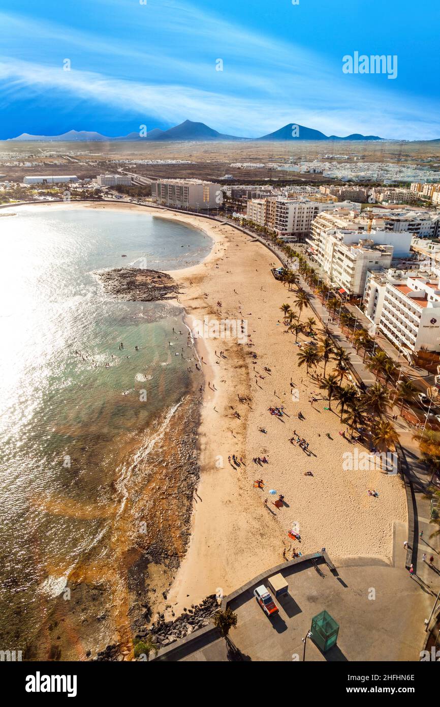 people enjoy the beautiful beach in Arrecife Stock Photo - Alamy