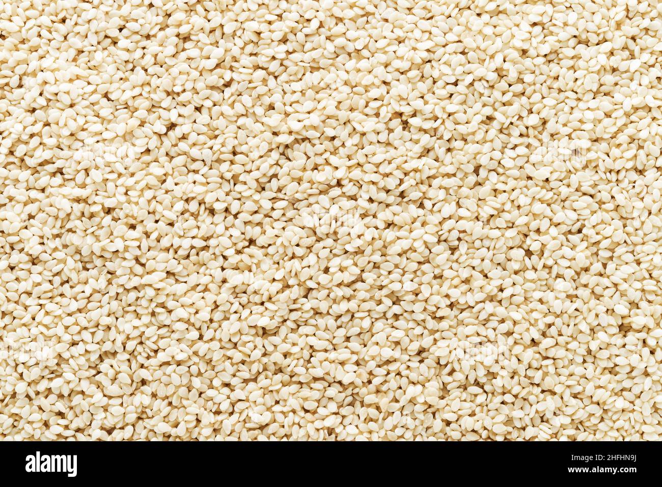 Sesame seeds as background. Top view, copy space Stock Photo - Alamy