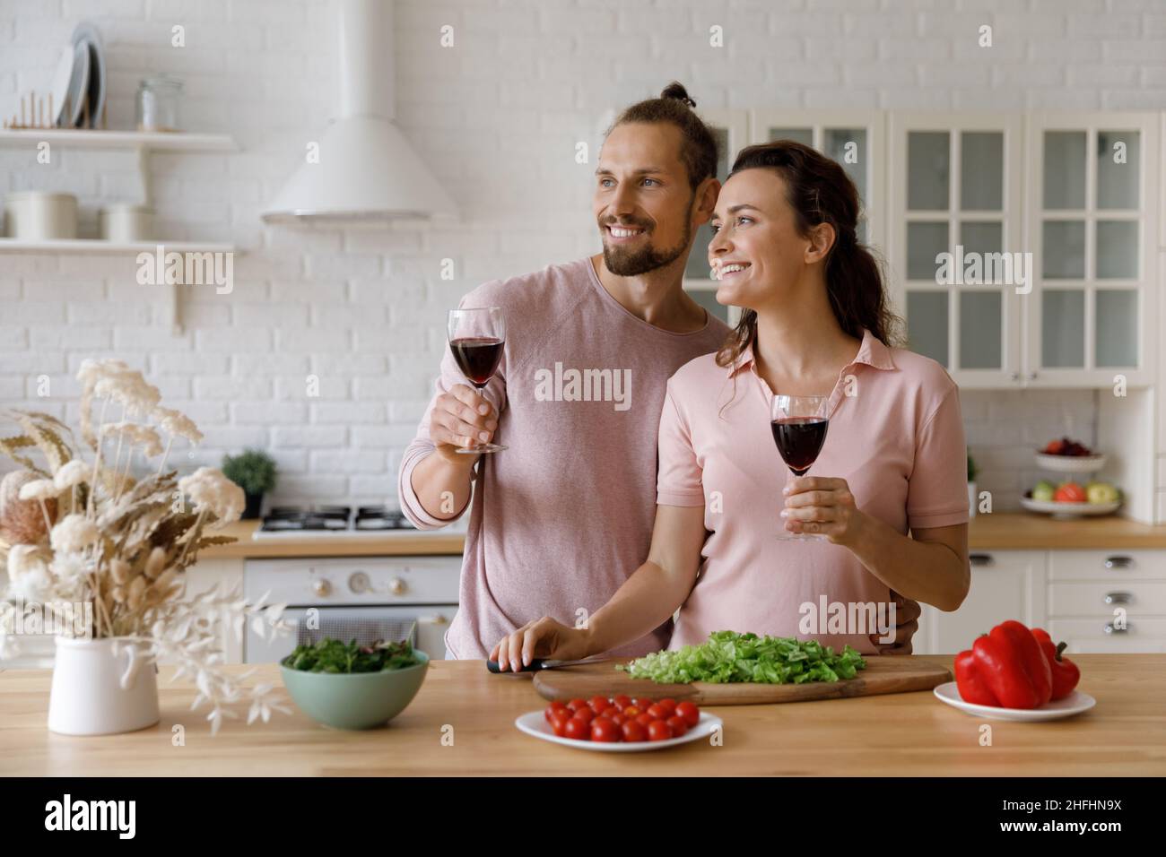 Dreamy loving millennial family couple visualizing future Stock Photo ...