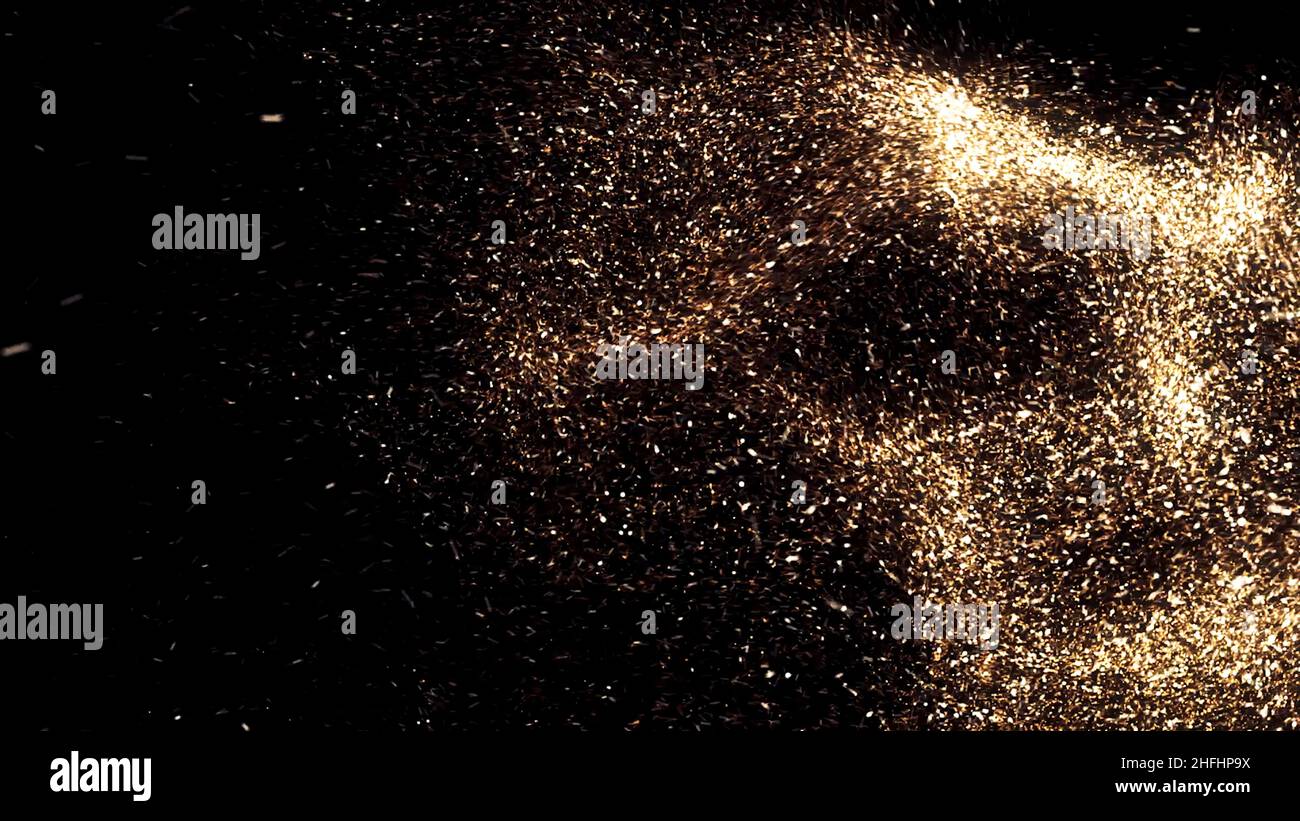 Beautiful golden flying dust particles with on black background. Fast ...