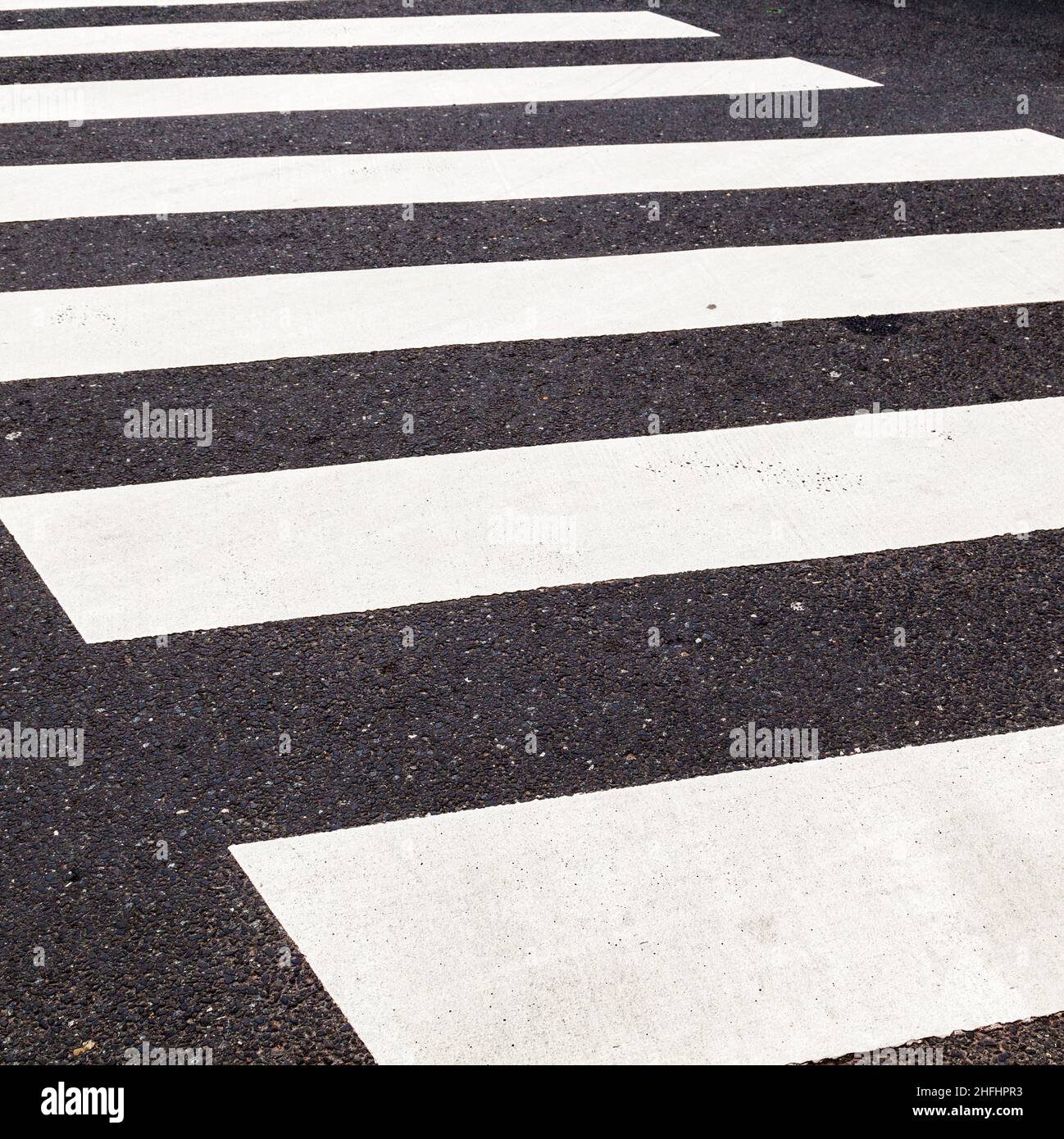 pedestrian crossing marked with white paint Stock Photo - Alamy