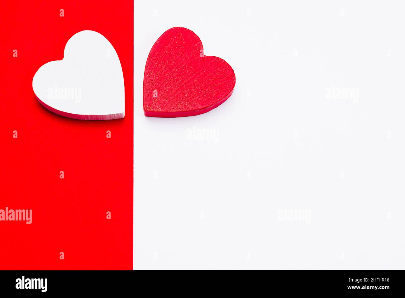 Two hearts red and white on a mixed background white and red.Greeting ...