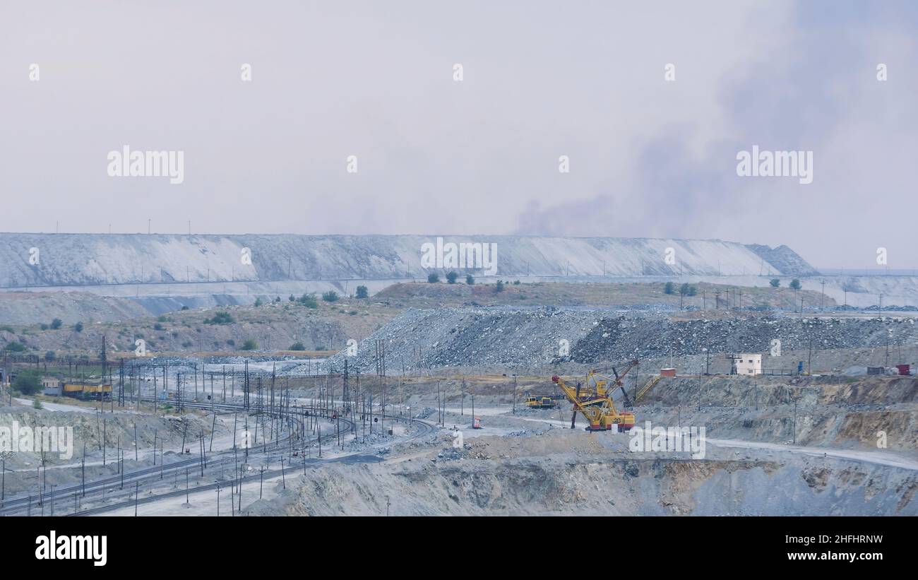 Panorama of an open quarry. Mining industry. Large quarry excavator in ...