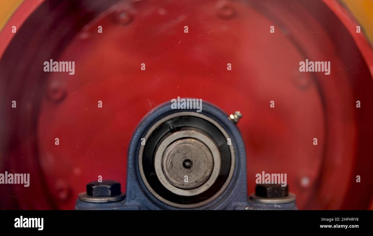 Close up of rotating metal mechanism, concept of heavy industry and ...