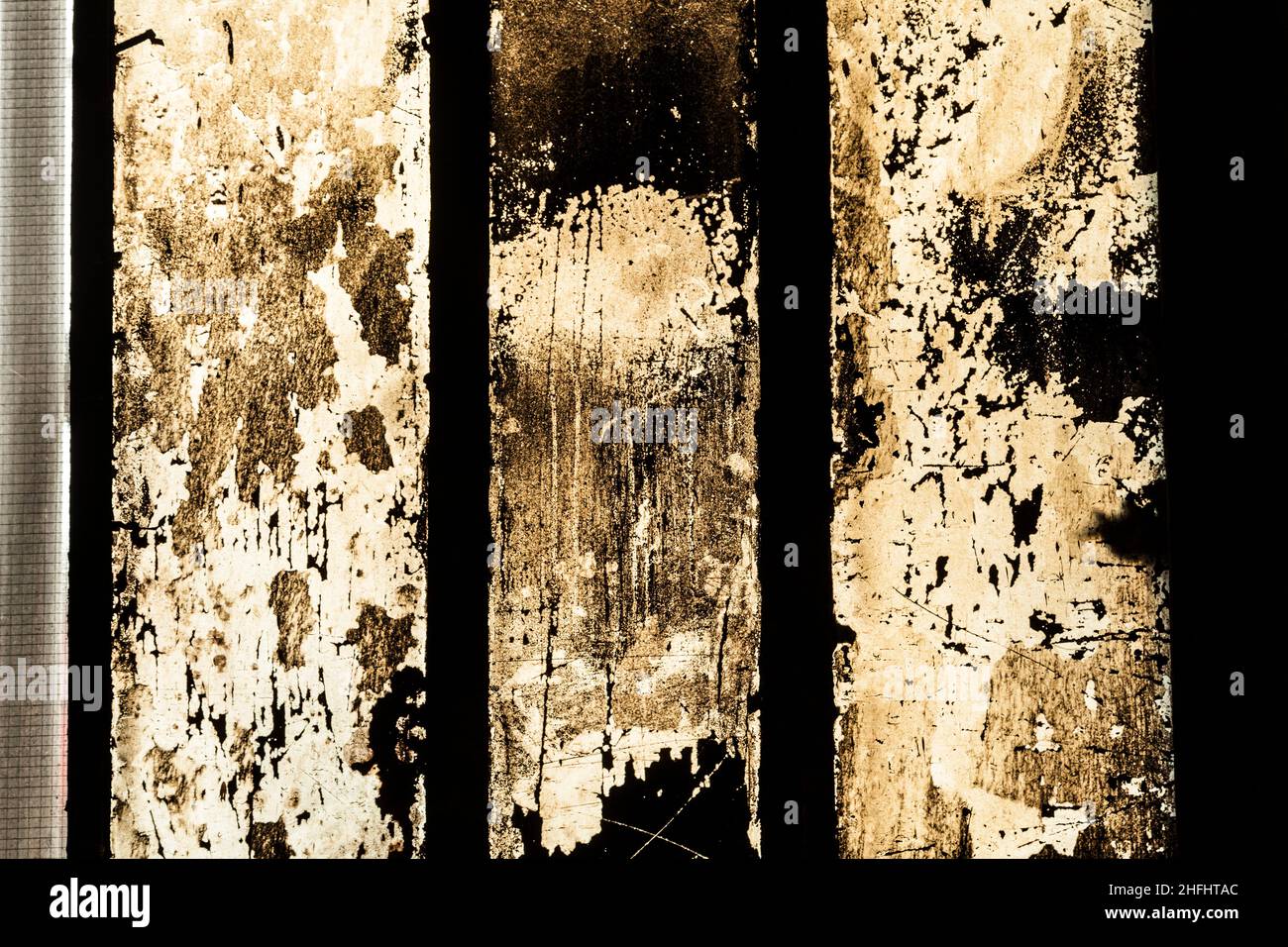 grungy window with carbon black symbolizes the dirt of iron works ...