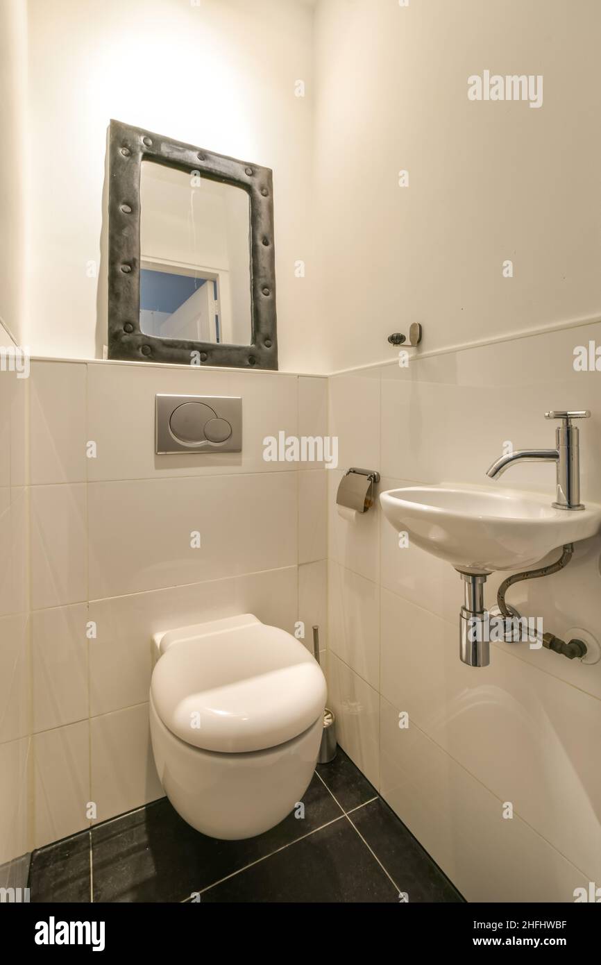 Interior of small clean restroom in miniature style Stock Photo - Alamy