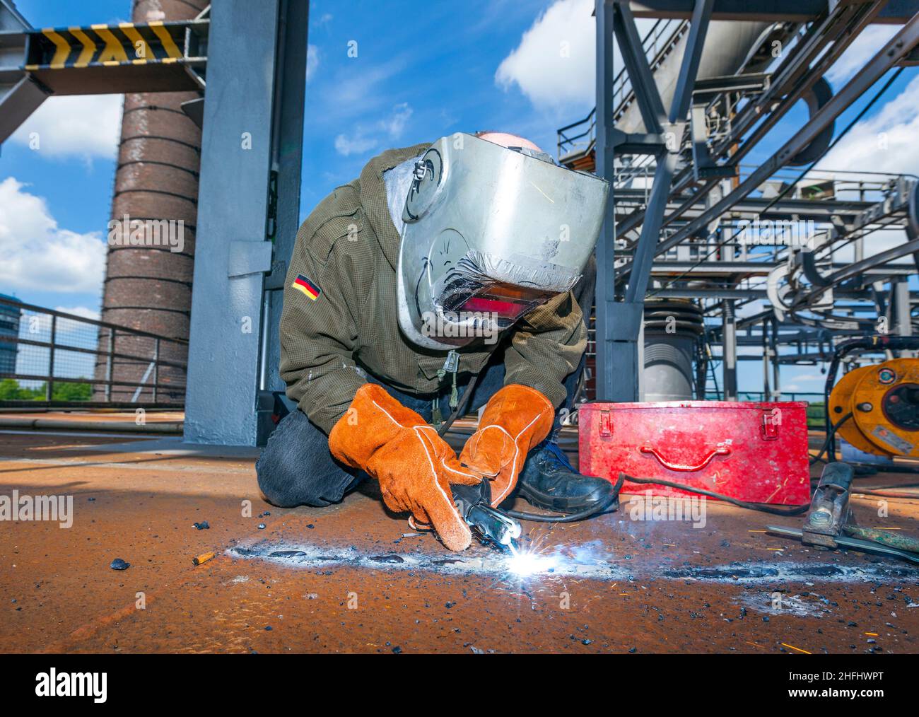 Welder at work at the famous industry site in Neuenkirchen Stock Photo ...