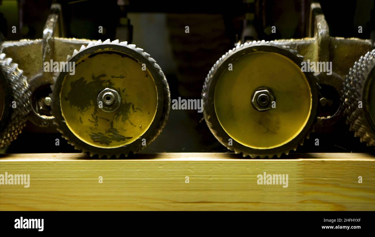Close up of professional carpenter grinding wooden boards in workshop ...