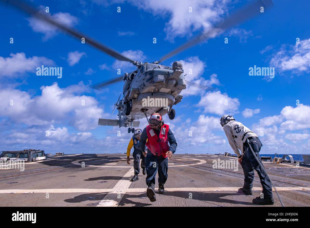 PACIFIC OCEAN (Jan. 13, 2022) Sailors perform a vertical replenishment ...