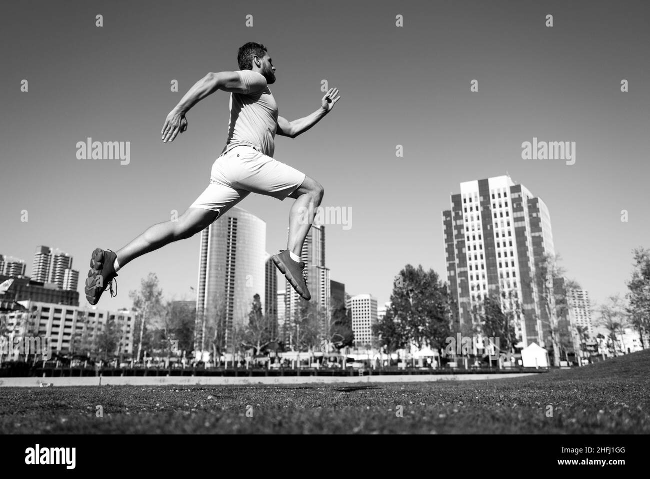 Athletic young man running in city. Dynamic jumping movement. Young and ...