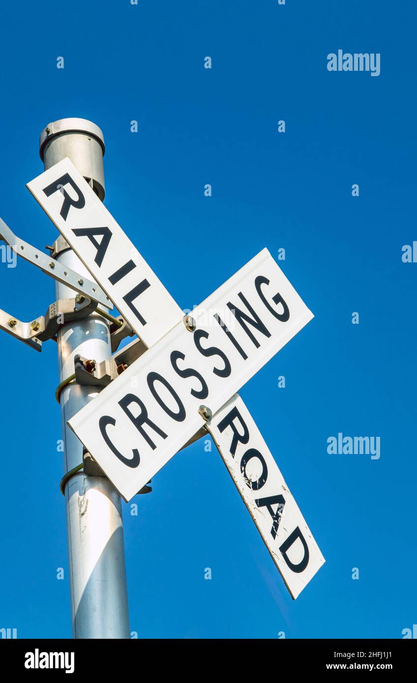 Railroad warning crossing sign under clear blue sky Stock Photo - Alamy