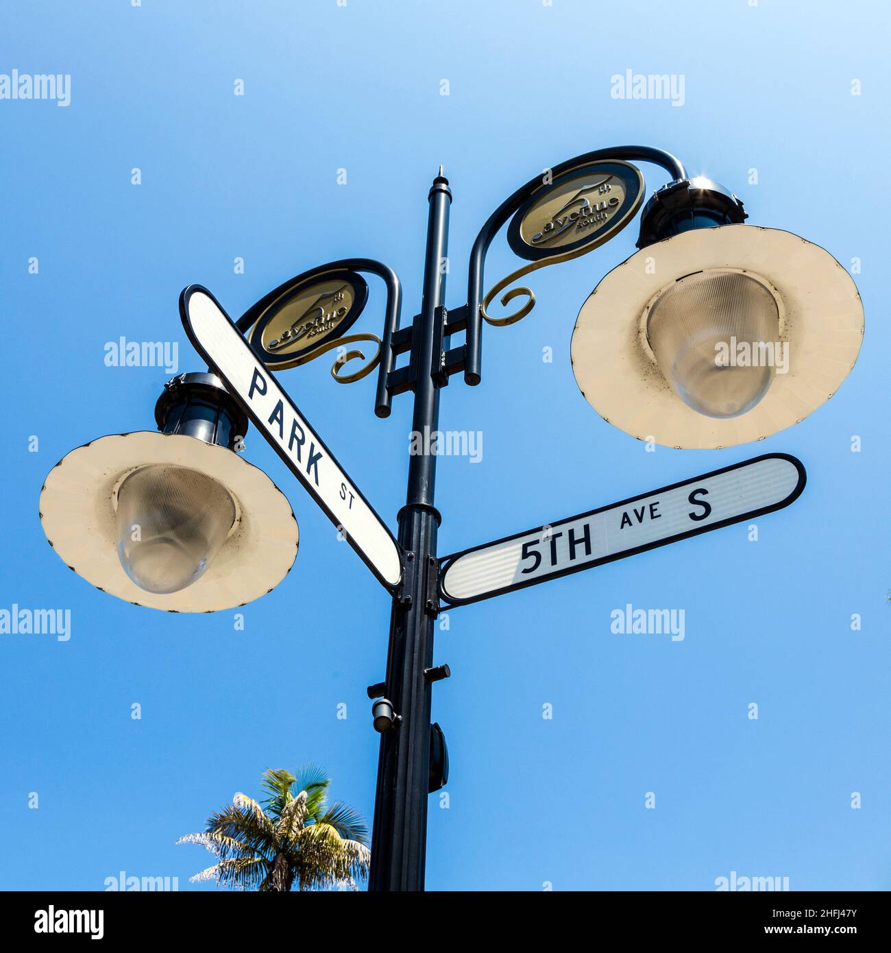 historical street sign in Naples, Florida under blue sky Stock Photo ...