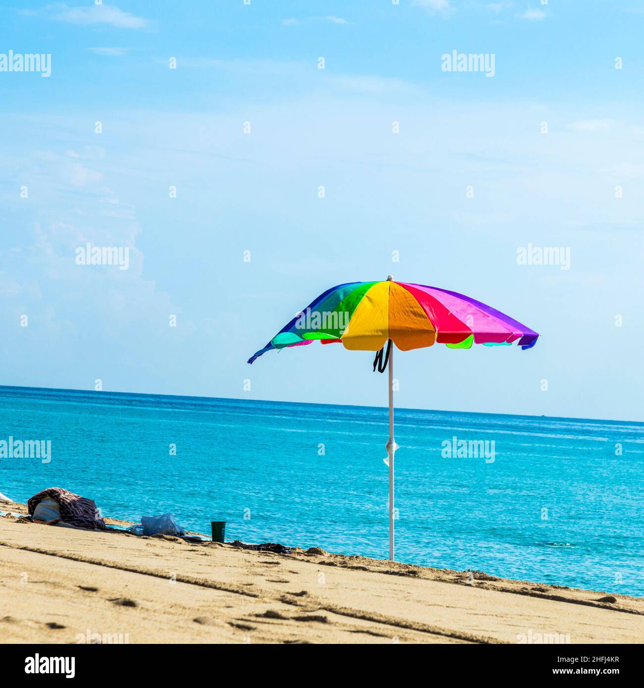 beach umbrella colorful in the sand at the beach Stock Photo - Alamy