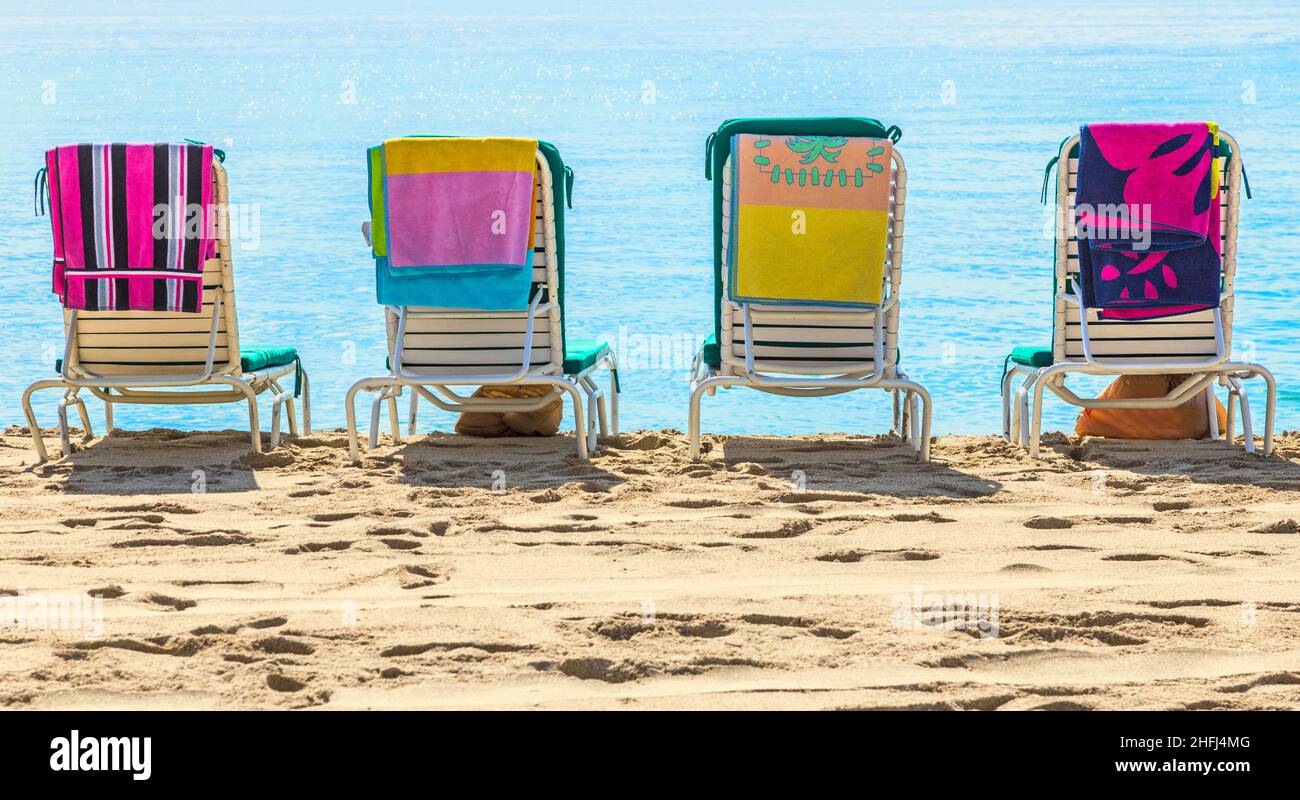 Row three beach chairs hi-res stock photography and images - Alamy