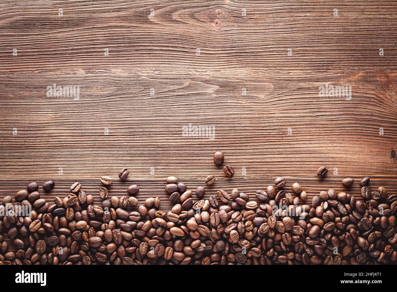 Coffee beans on wooden background Stock Photo - Alamy