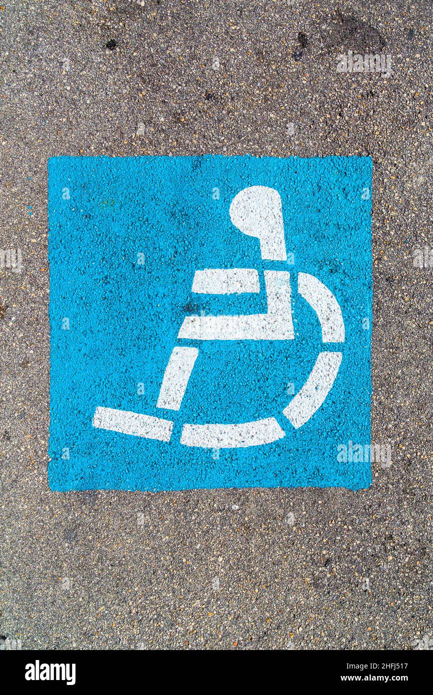 wheelchair sign at the parking lot in blue Stock Photo - Alamy