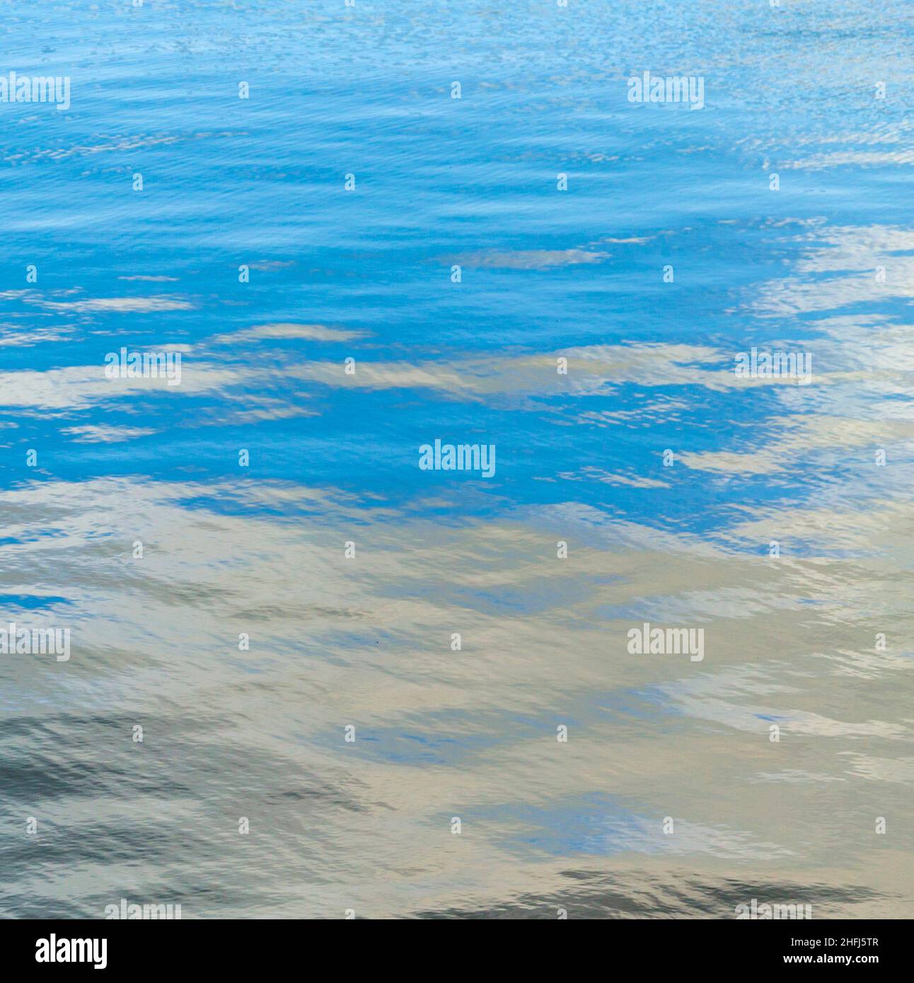 reflection of sky and clouds in the water of the ocean Stock Photo - Alamy