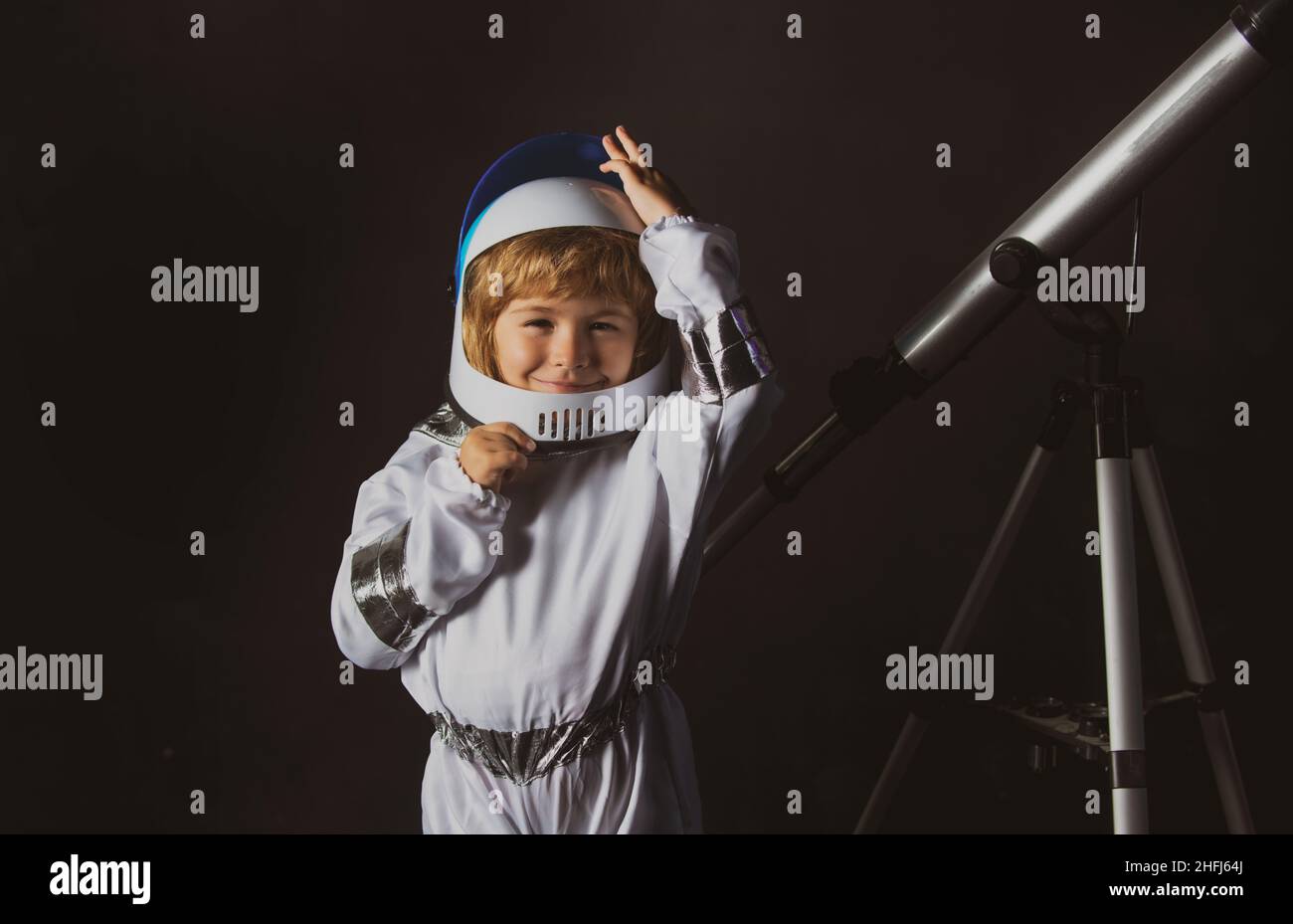 Adorable cute boy astronaut in outer space. Child imagines himself to ...