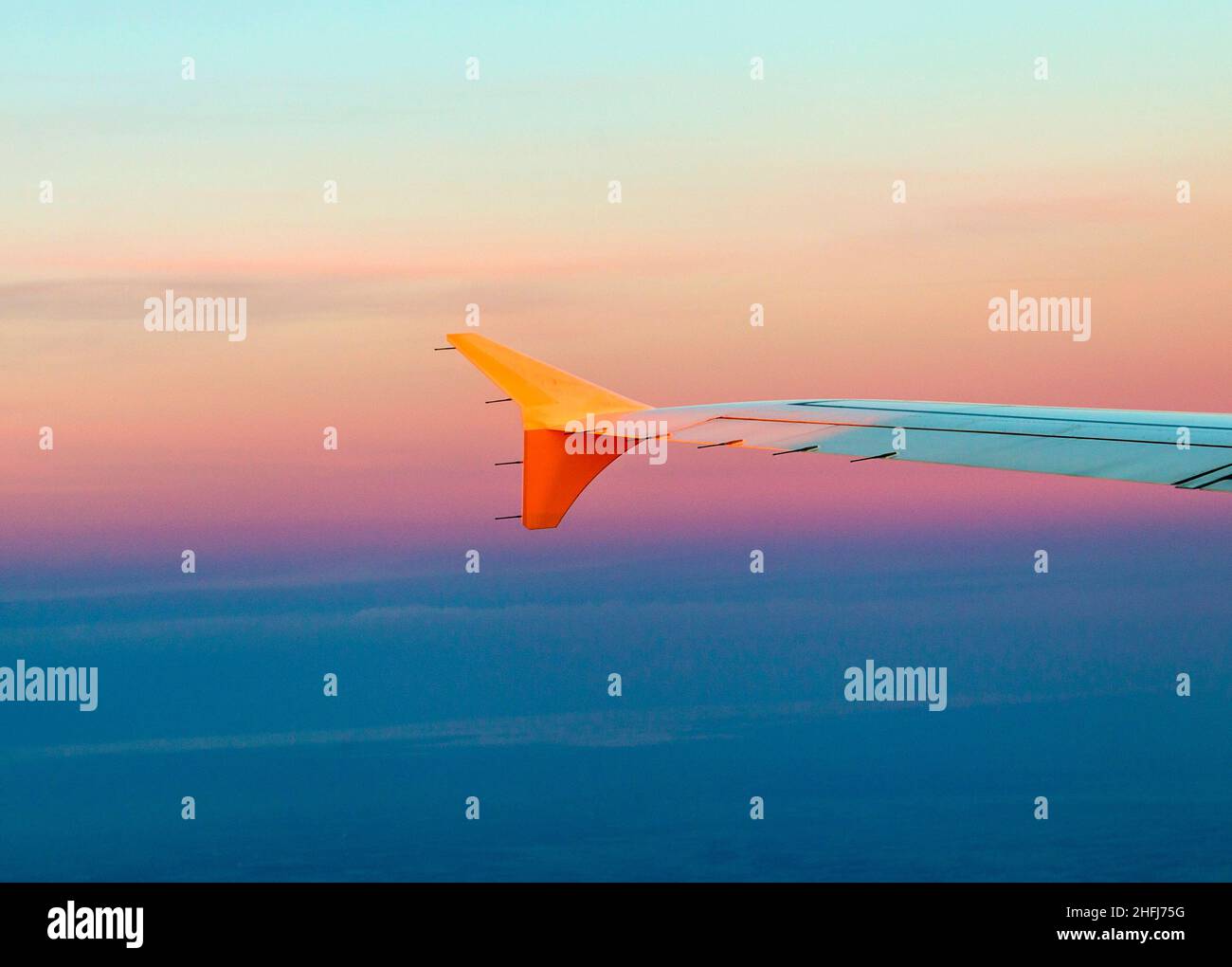 wing of aircraft in the morning sun Stock Photo - Alamy