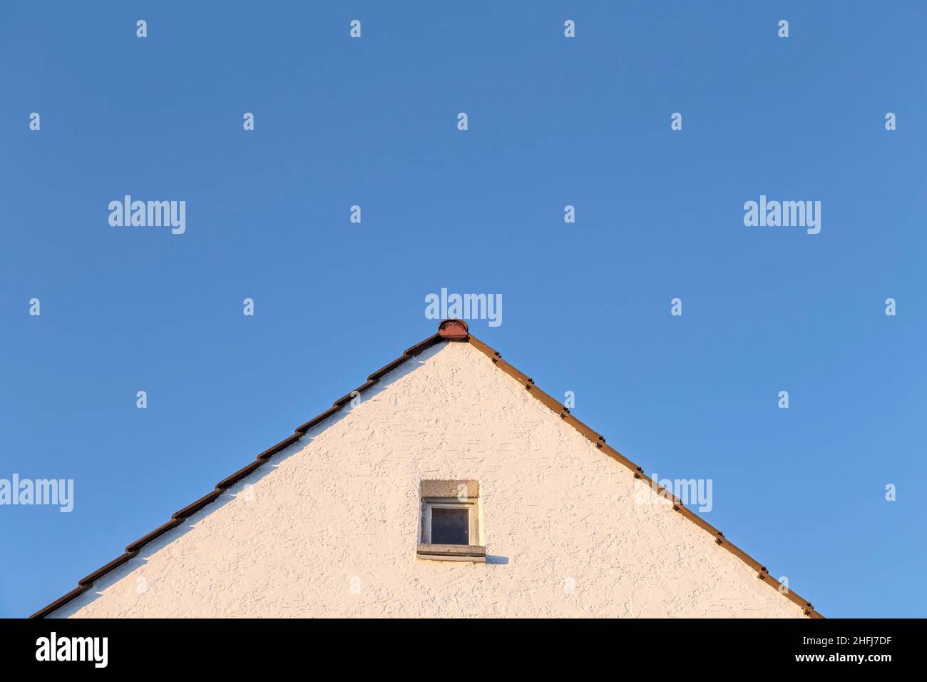 house facade with gable and roof pattern under blue sky Stock Photo - Alamy