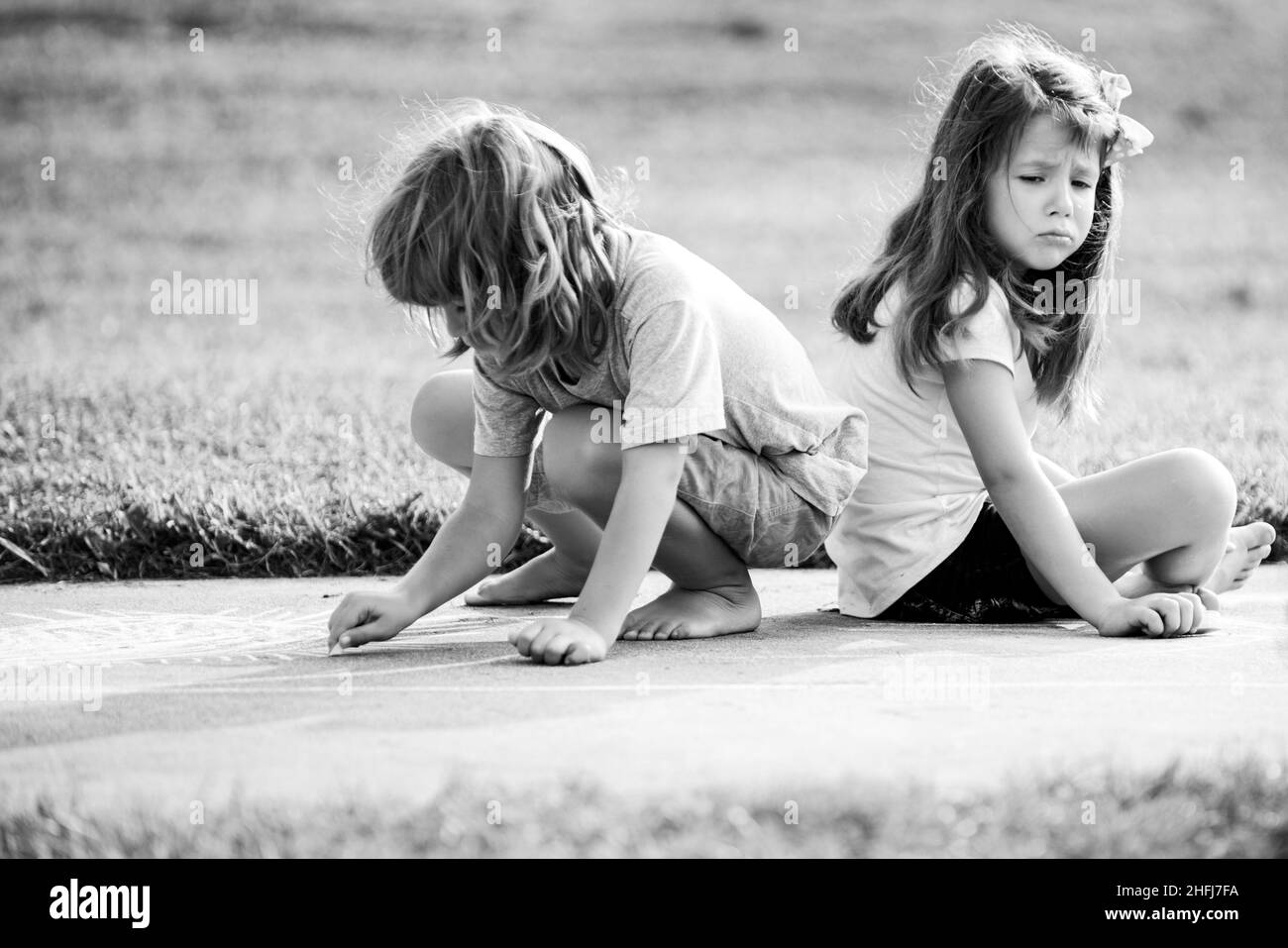Kids relationships and adaptation. Couple of children playing outdoor ...