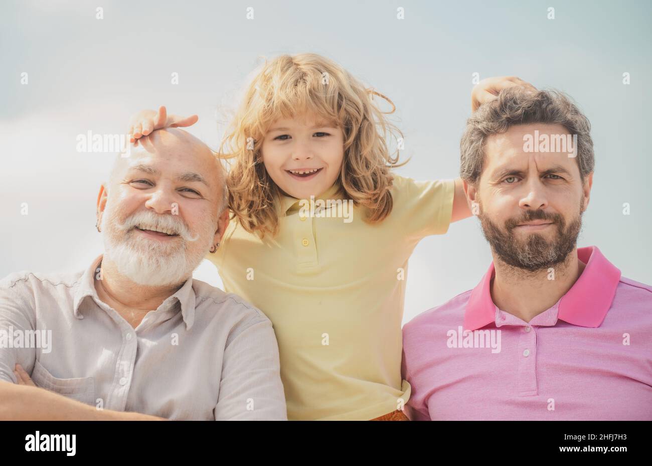 Men generation portrait of grandfather father and funny son child ...